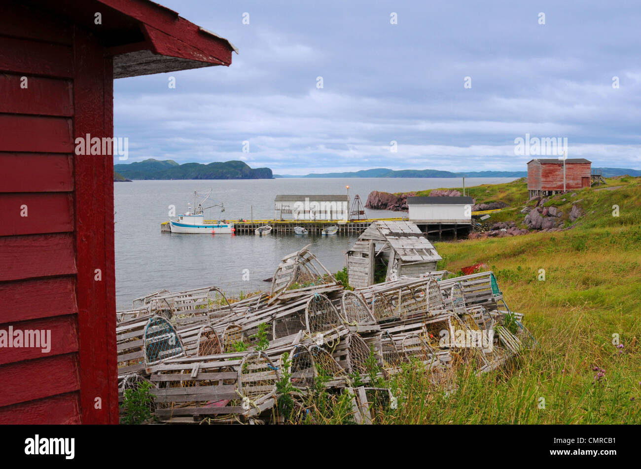Fishing boat dock & lobster traps, Open Hall, Newfoundland Stock Photo ...