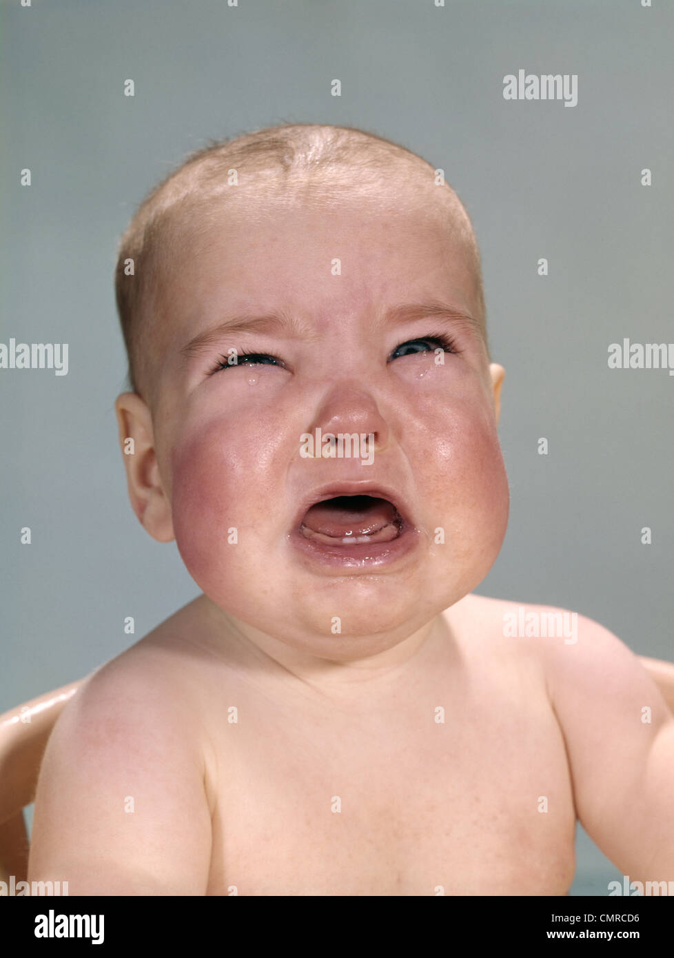1960s PORTRAIT OF VERY UNHAPPY CRYING BABY WITH RED CHUBBY CHEEKS Stock ... 1960s PORTRAIT OF VERY UNHAPPY CRYING BABY WITH RED CHUBBY CHEEKS Stock ...