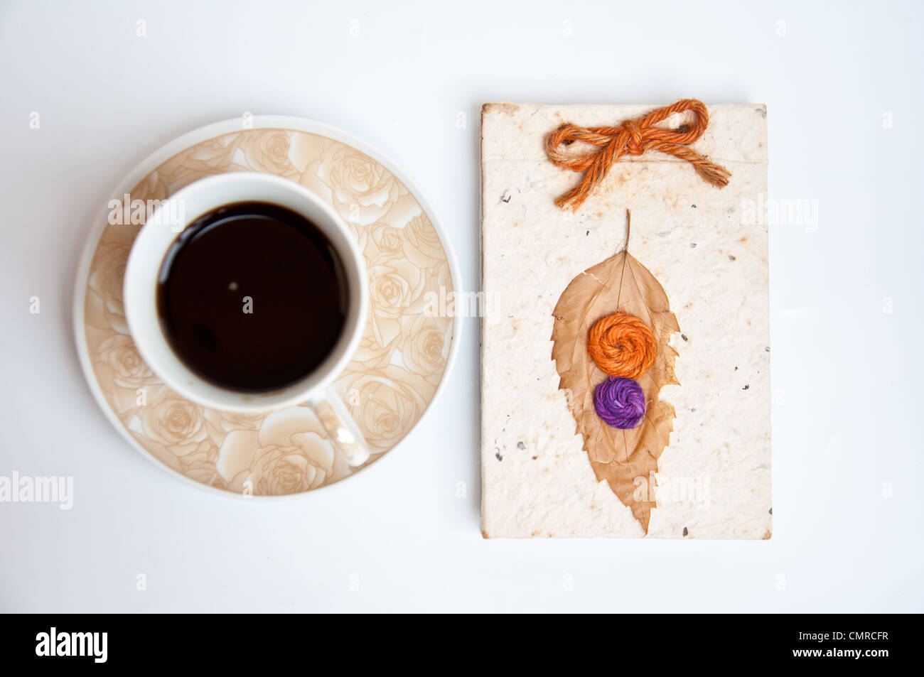 Black coffee and paper on white background Stock Photo - Alamy