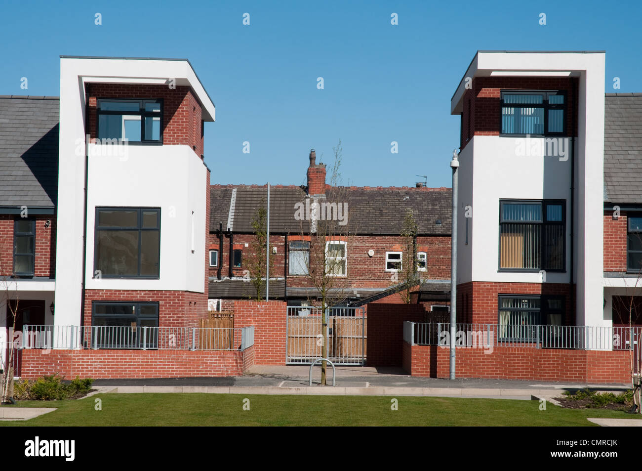 Old and new housing. Maine Place new housing development, against ...