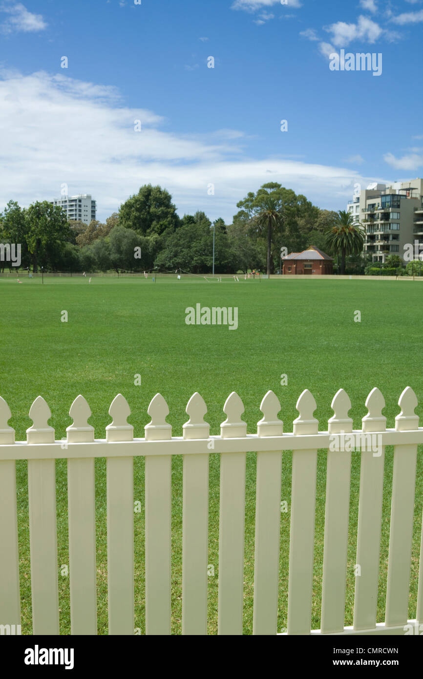 Fence overlooking a park and field Stock Photo - Alamy