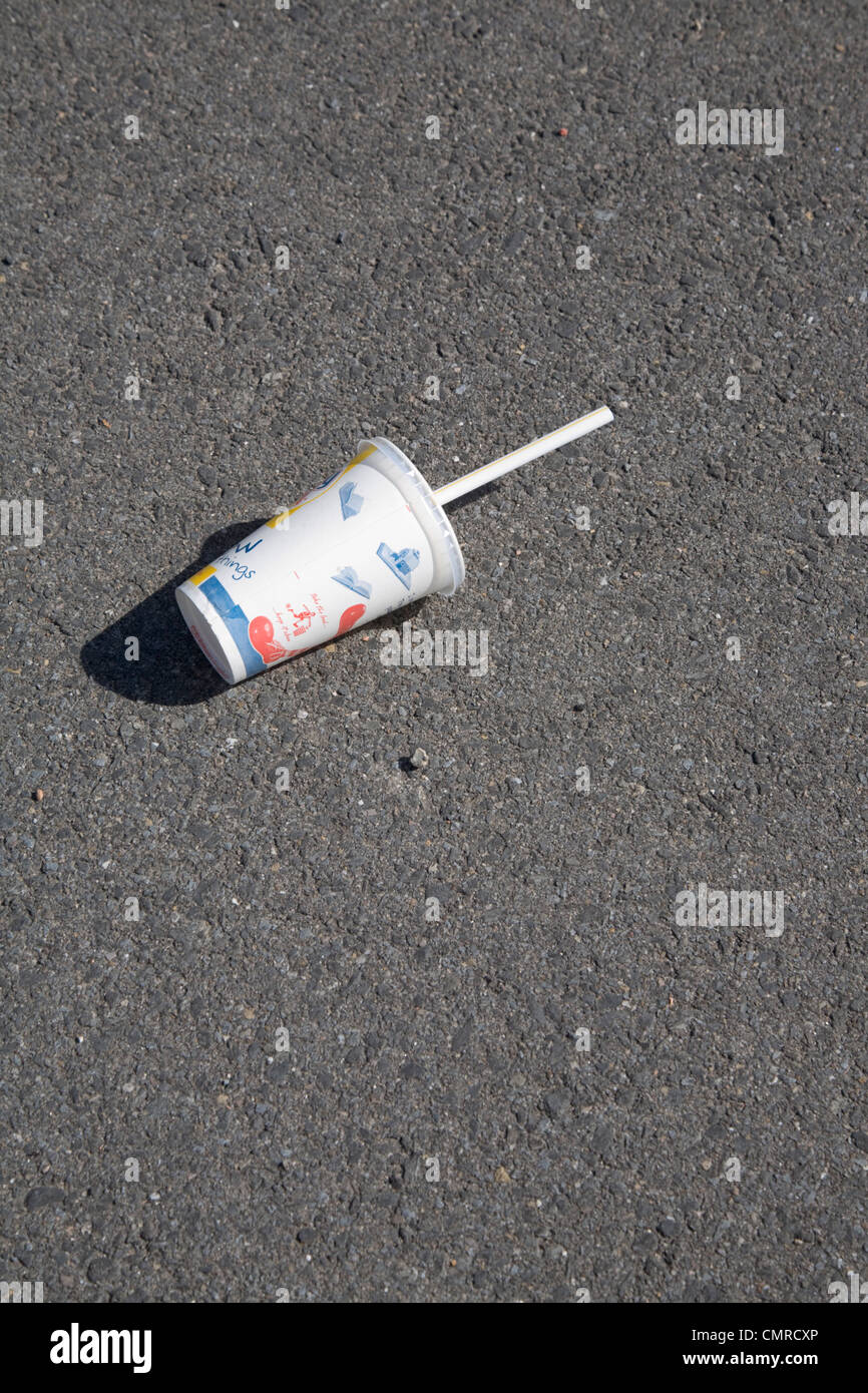 Discarded soft drink with straw Stock Photo - Alamy