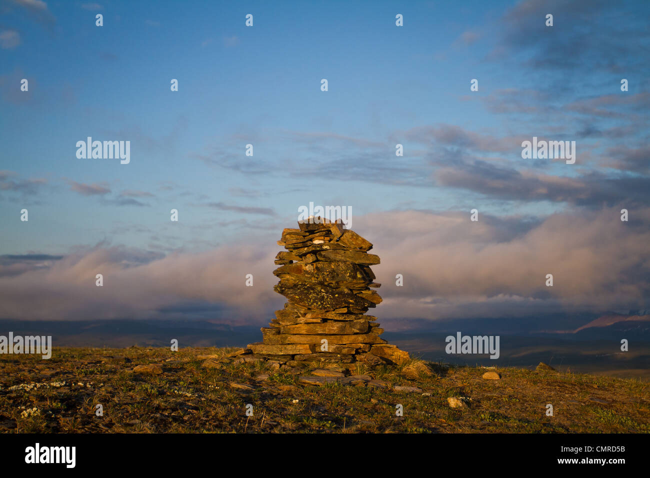 A stone cairn on a clear summer evening on a ridge in Denali National ...