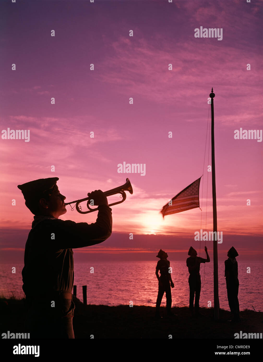 Lowering raising american flag hi-res stock photography and images - Alamy