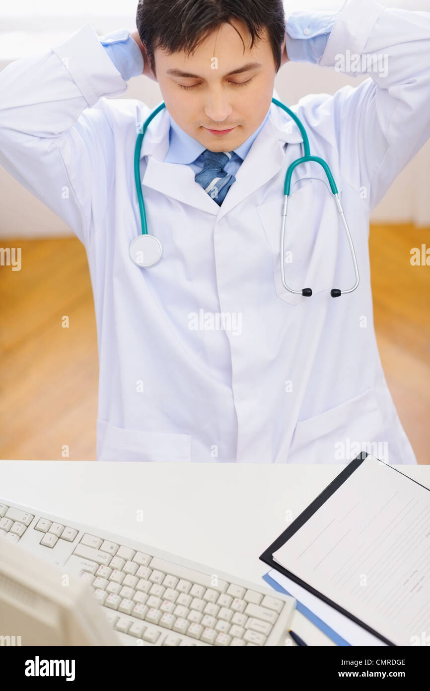 Medical doctor relaxing at office. top view Stock Photo - Alamy