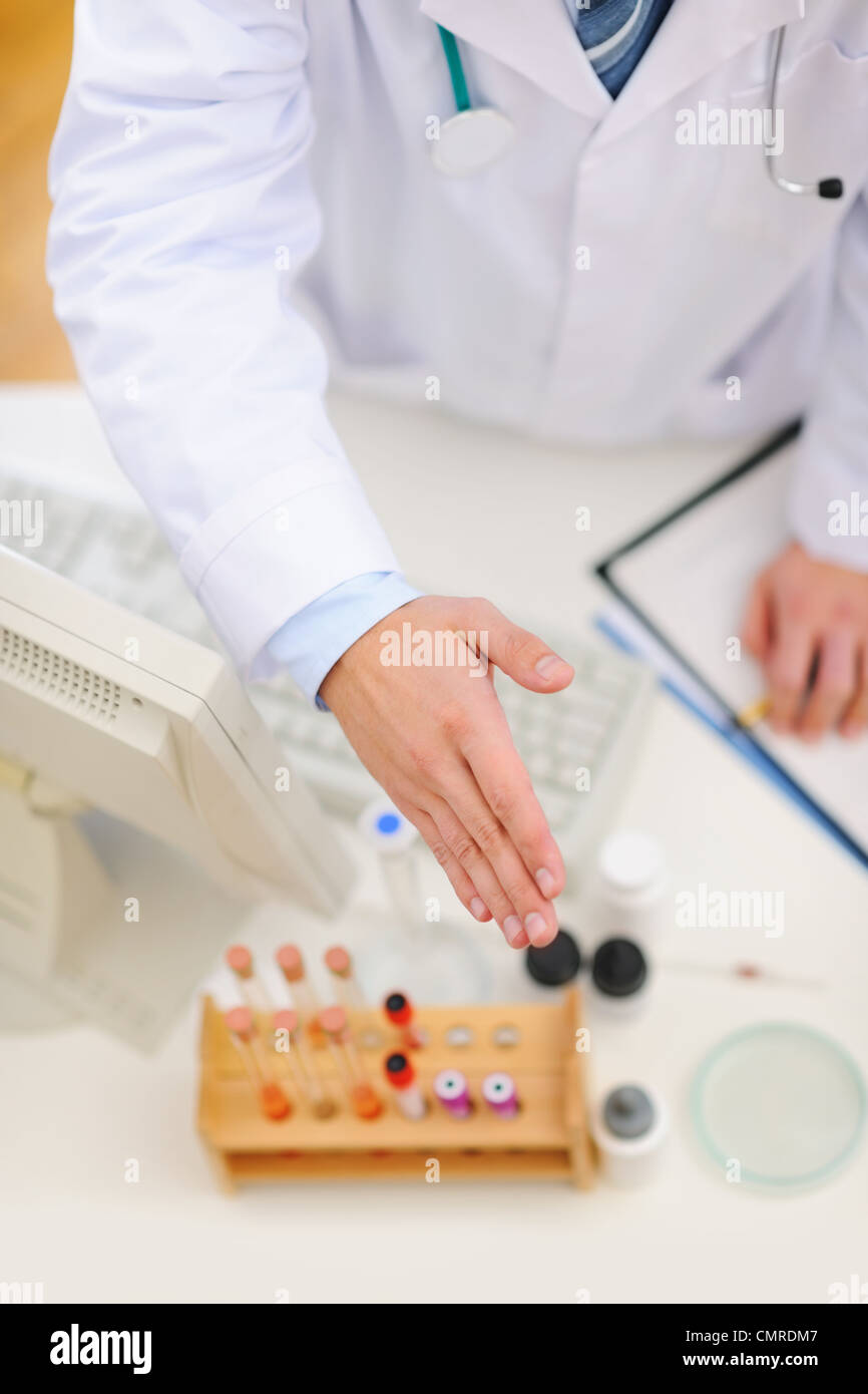 Medical doctor stretching hand for handshake. Top view Stock Photo - Alamy