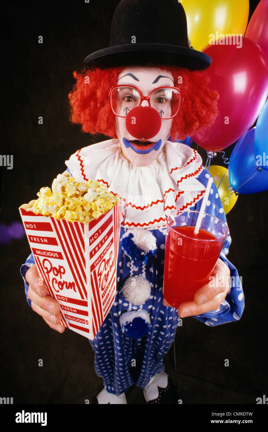 1980s 1990s CLOWN WITH GLASSES AND HAT HOLDING POPCORN AND DRINK ...