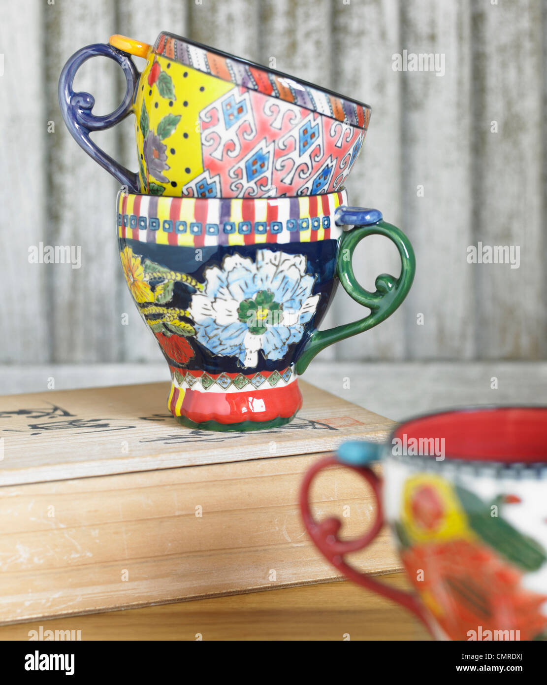 Stack of colorful mugs Stock Photo - Alamy