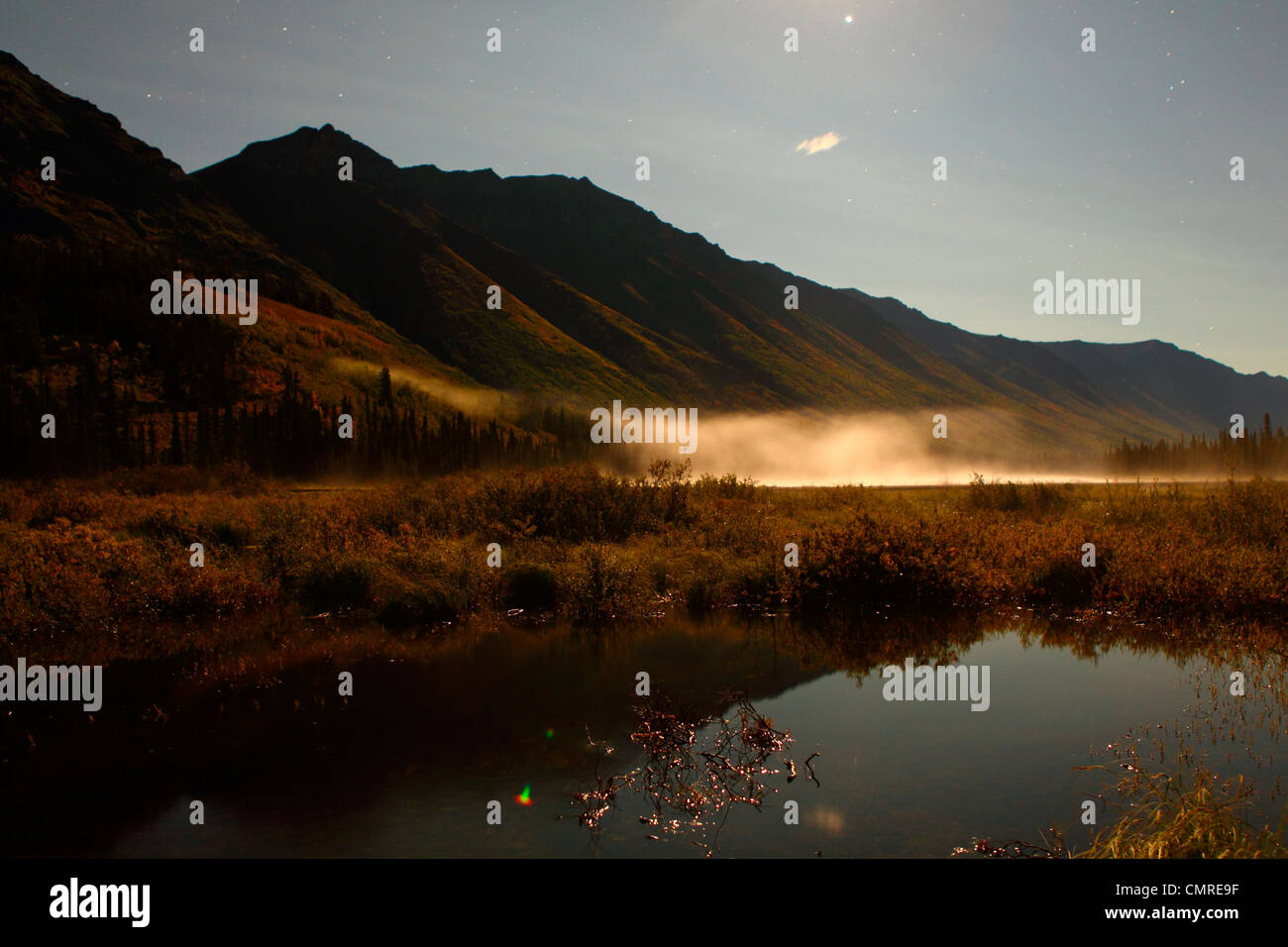 The mountains surrounding Annie Lake in full moonlight near Whitehorse ...