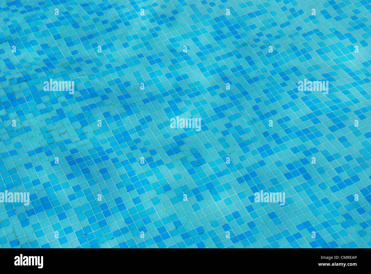 Clean blue water in a beautiful turquoise swimming pool as a background ...