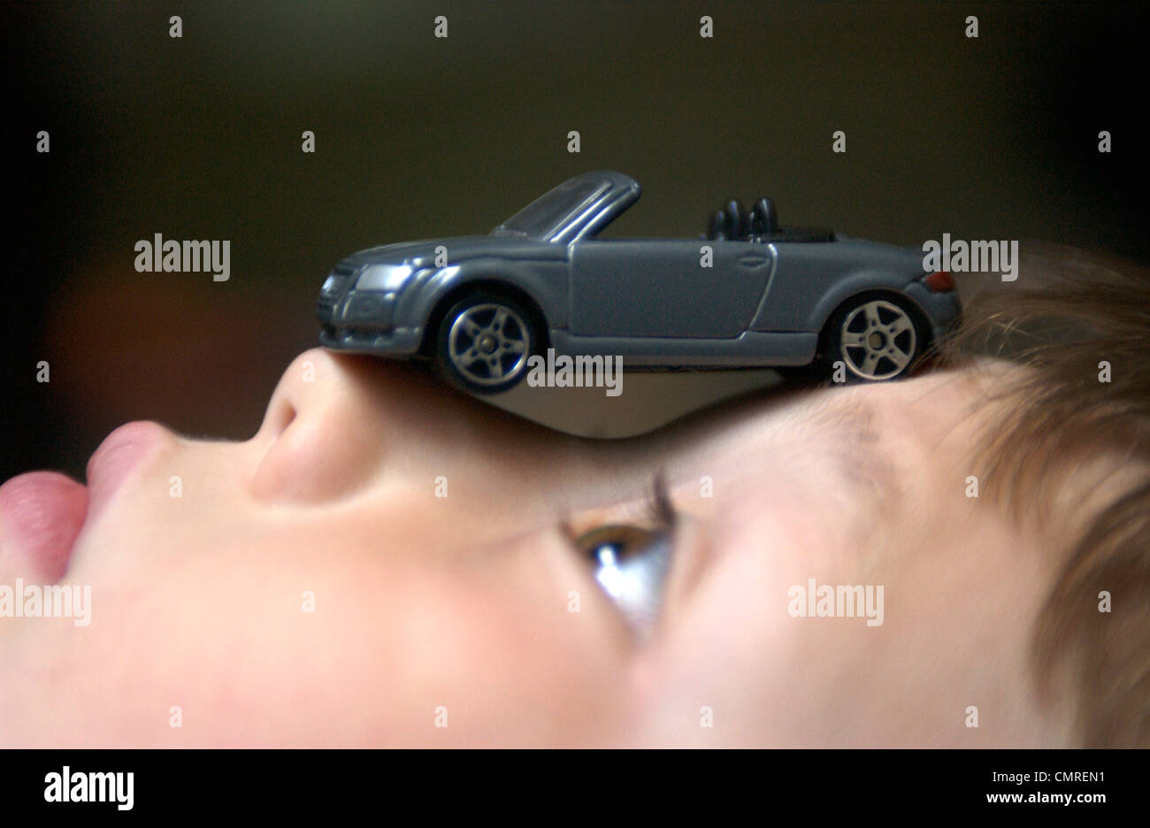 Boy with Car on Face Stock Photo - Alamy