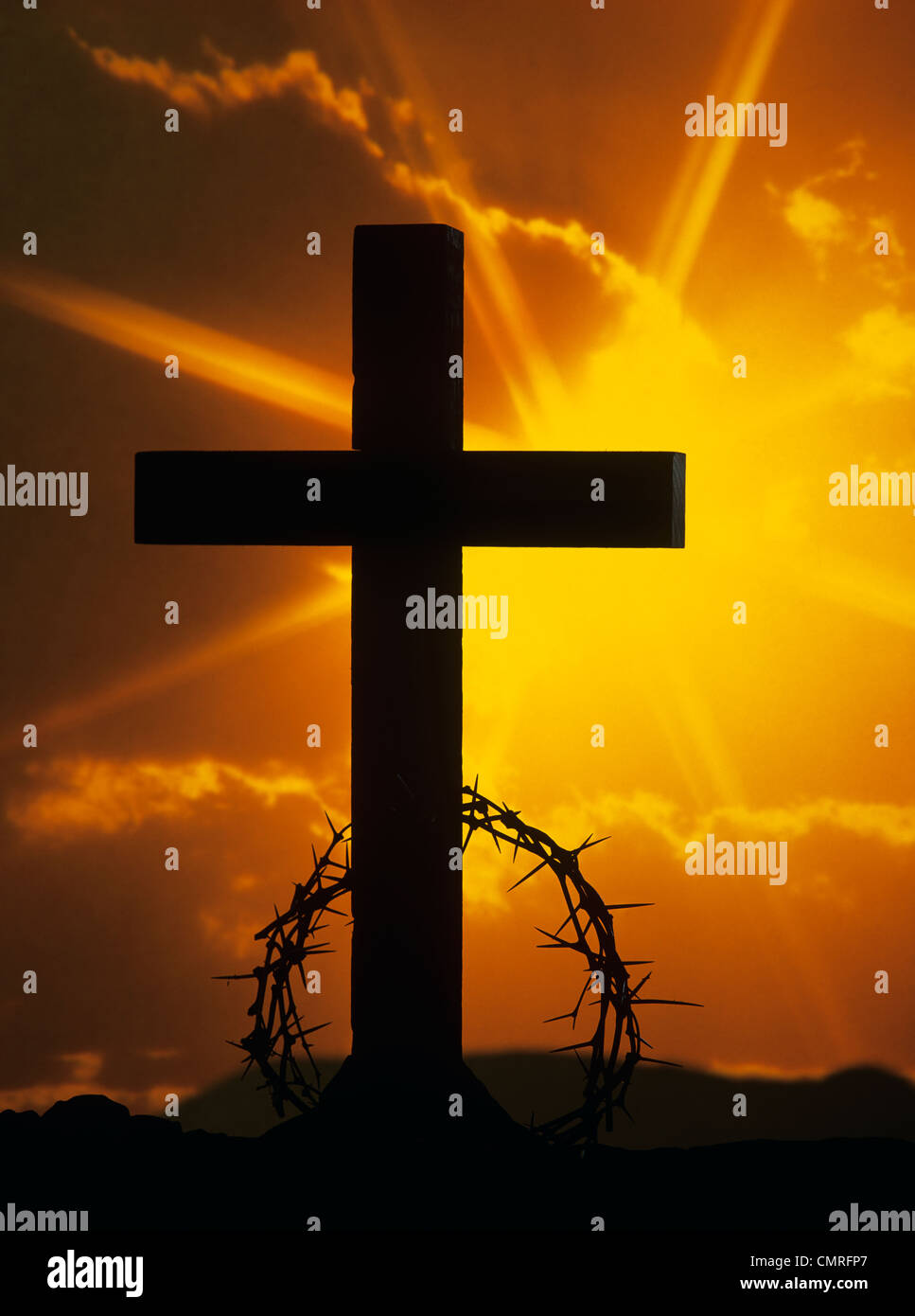 1990s CROSS AND CROWN OF THORNS WITH RAYS OF SUN Stock Photo - Alamy