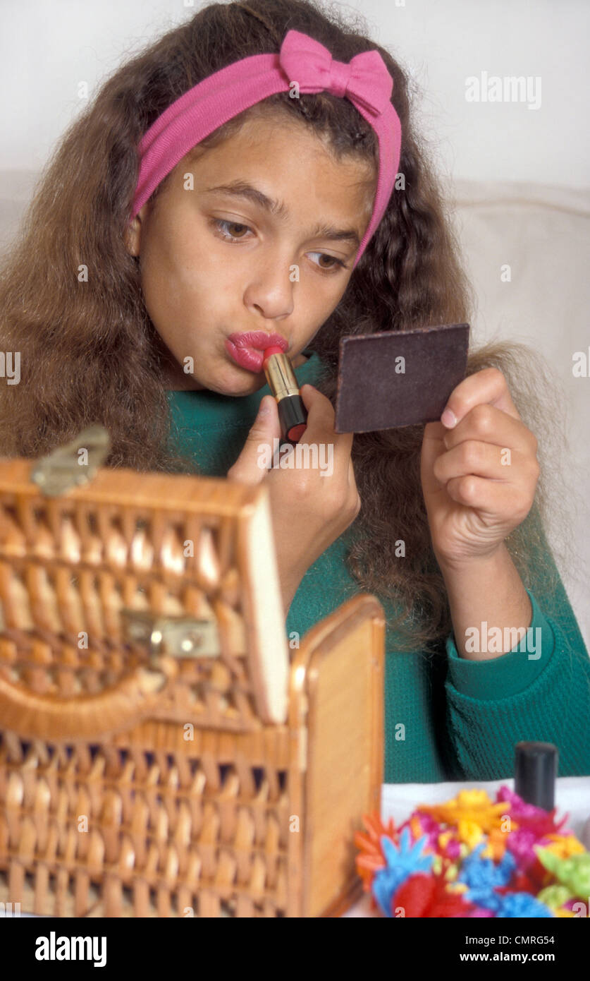 young girl playing at getting made up Stock Photo - Alamy