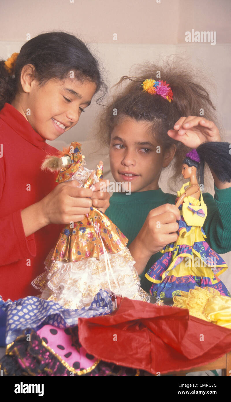 two girls playing with Barbie dolls Stock Photo - Alamy
