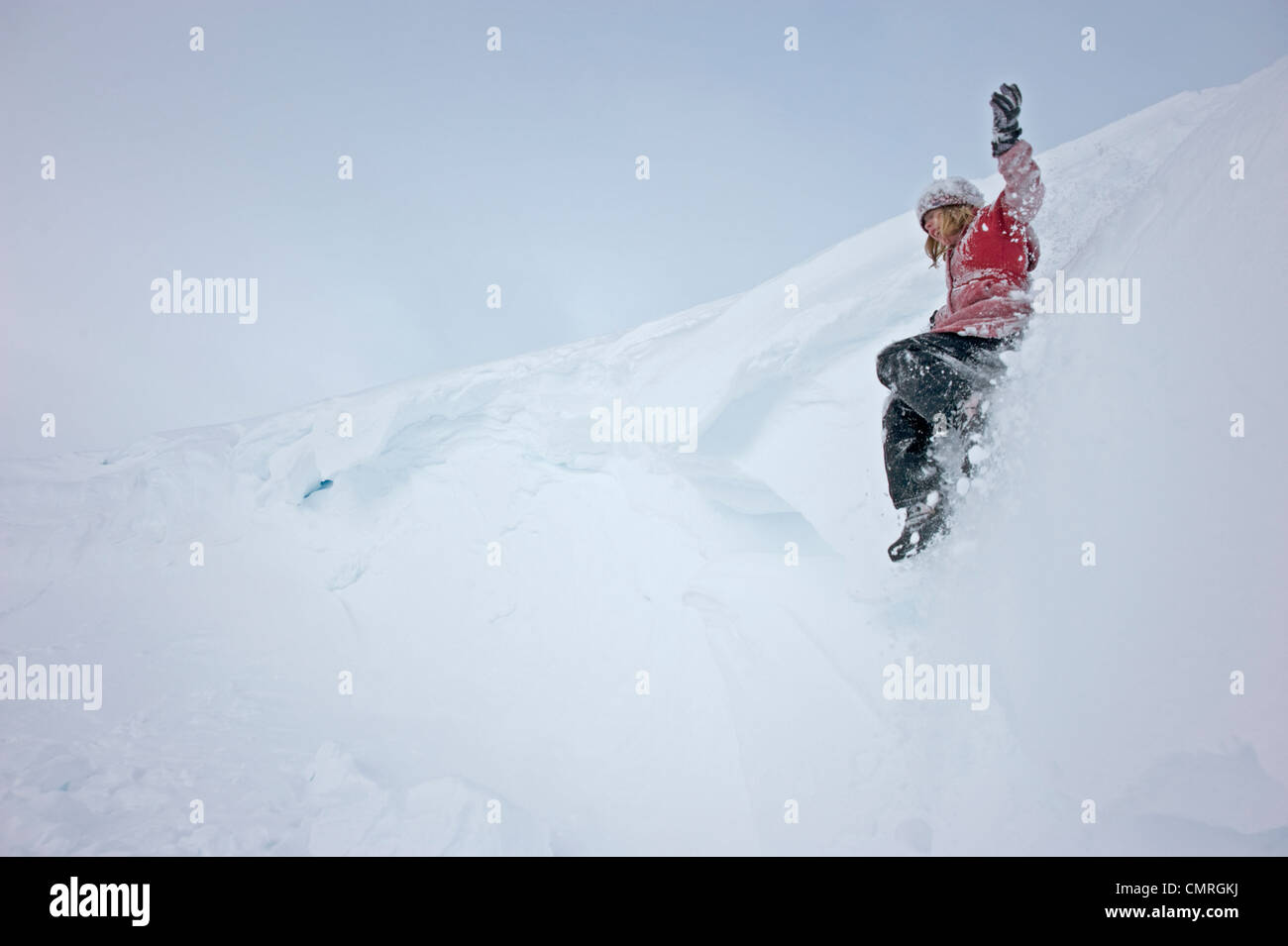 Girl sliding in snow, Haines Summit, British Columbia Stock Photo - Alamy