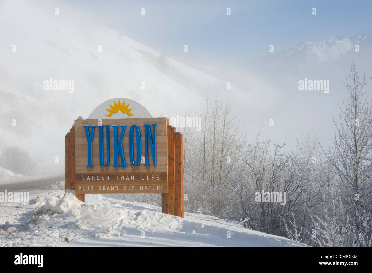 Mid-winter image of Welcome sign on Yukon, British Columbia border ...
