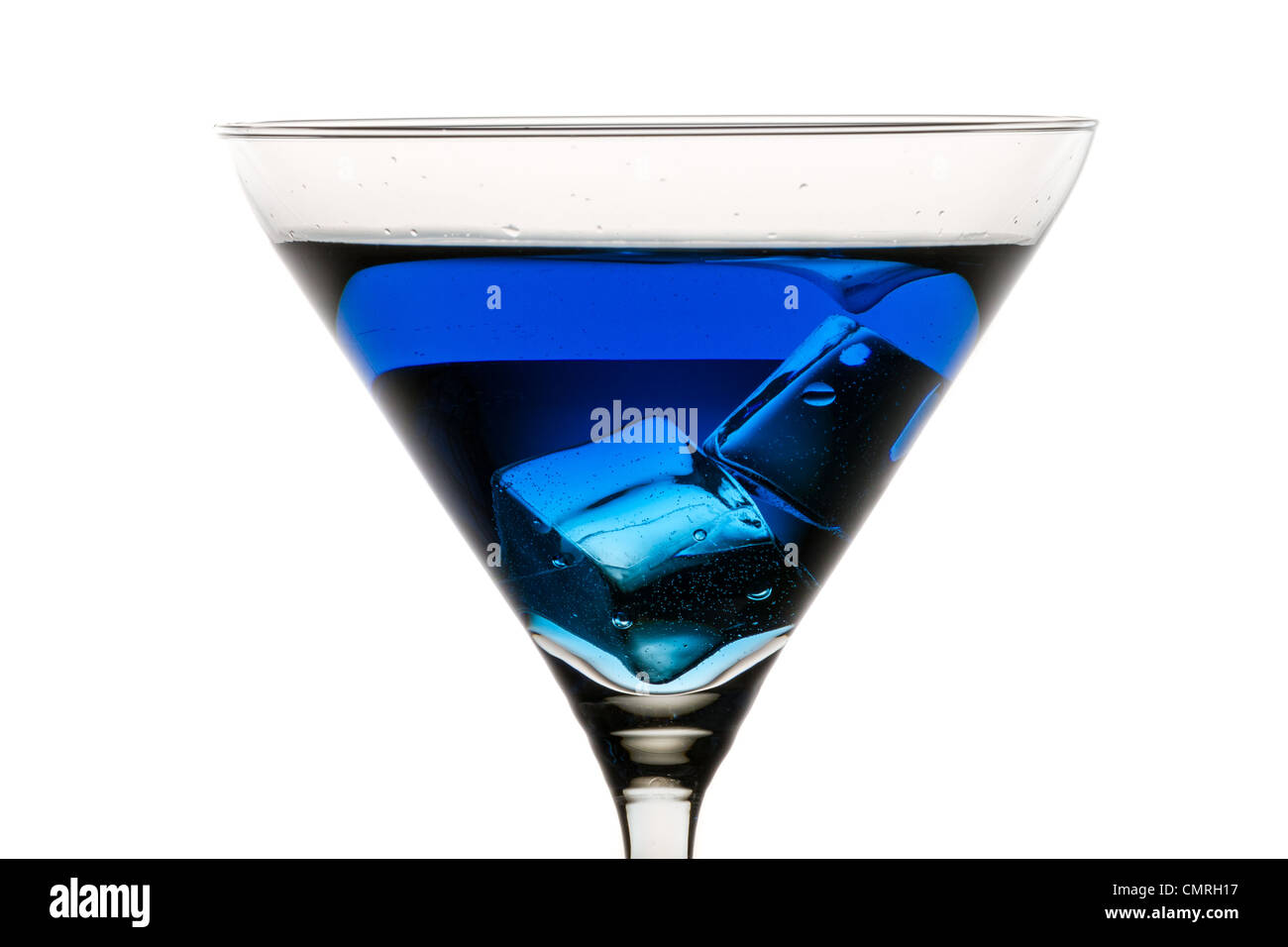 Martini glass with ice and blue liqueur Stock Photo - Alamy