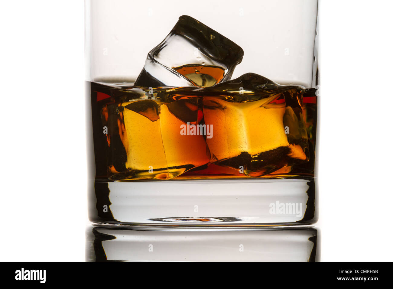 Closeup brandy with glass and ice cubes on white background Stock Photo ...