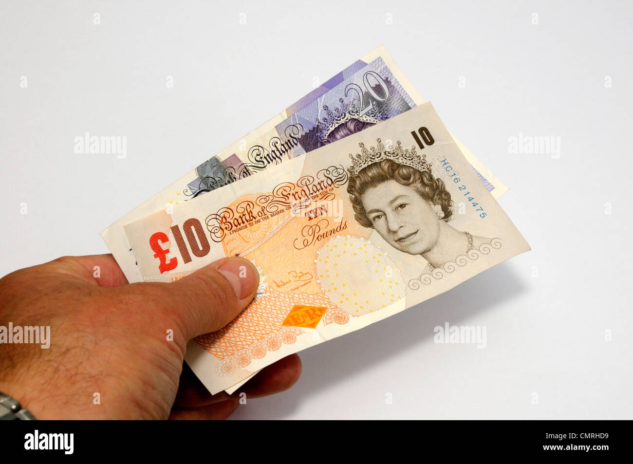 Hand pound notes hi-res stock photography and images - Alamy