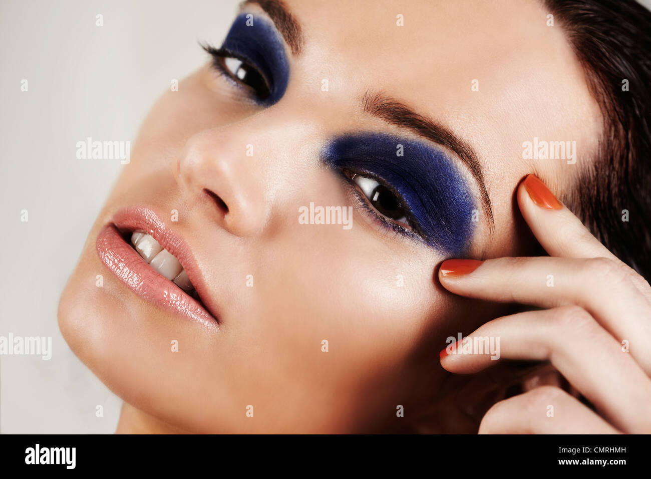 Young woman with blue eye shadows Stock Photo - Alamy