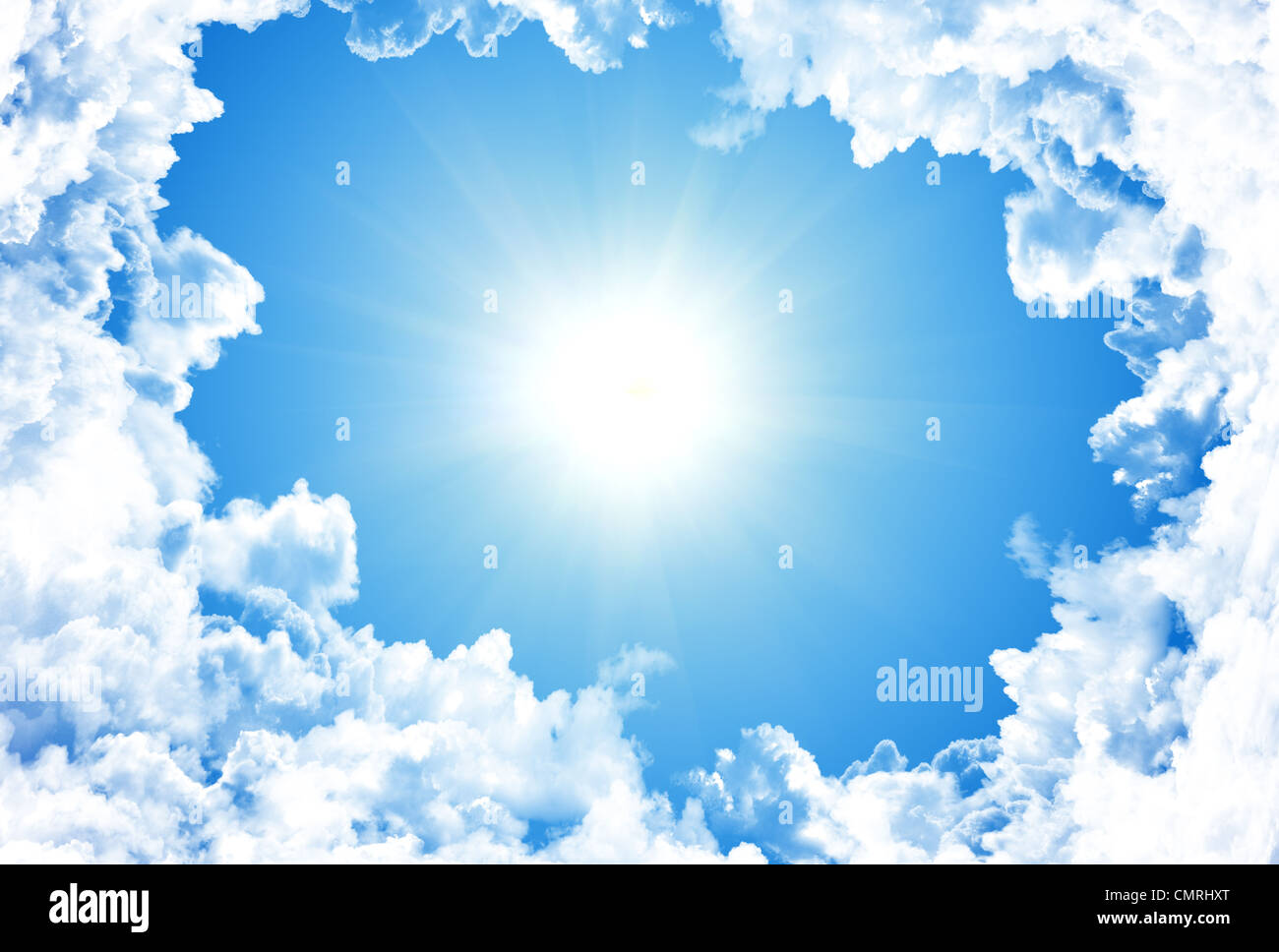 Sun in bright blue sky Stock Photo - Alamy