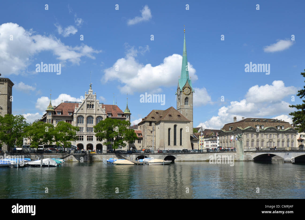 The River Limmat waterfront of Zurich with the spire of St. Peters ...