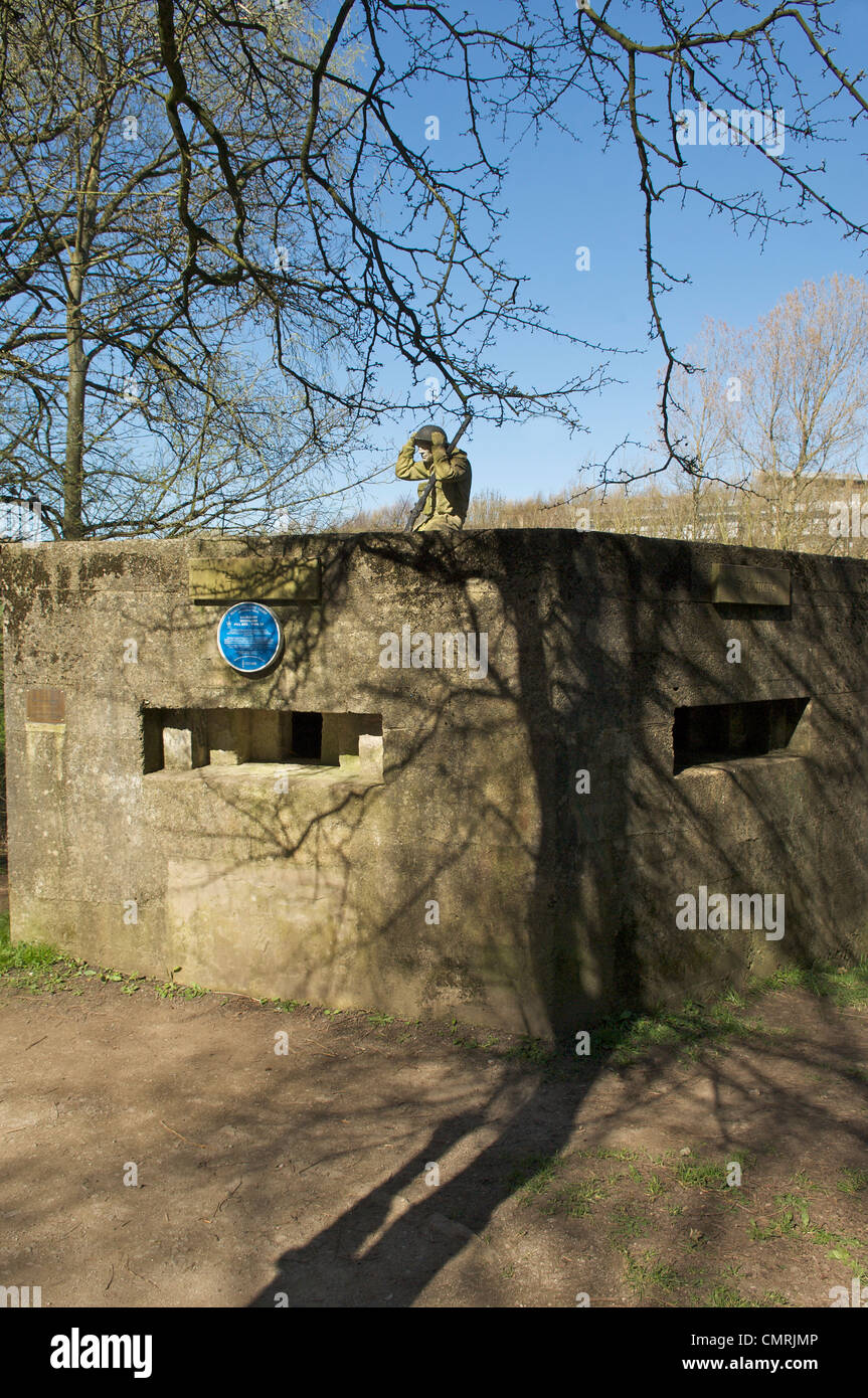 Restored second world war pill box with sculpture of soldier on roof ...