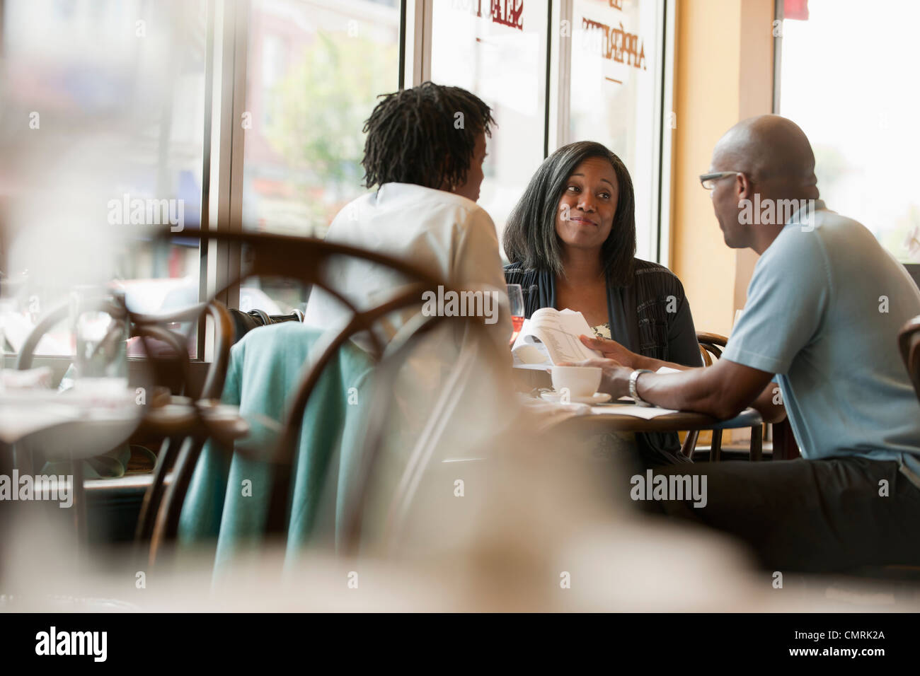 African American co-workers working in restaurant Stock Photo - Alamy