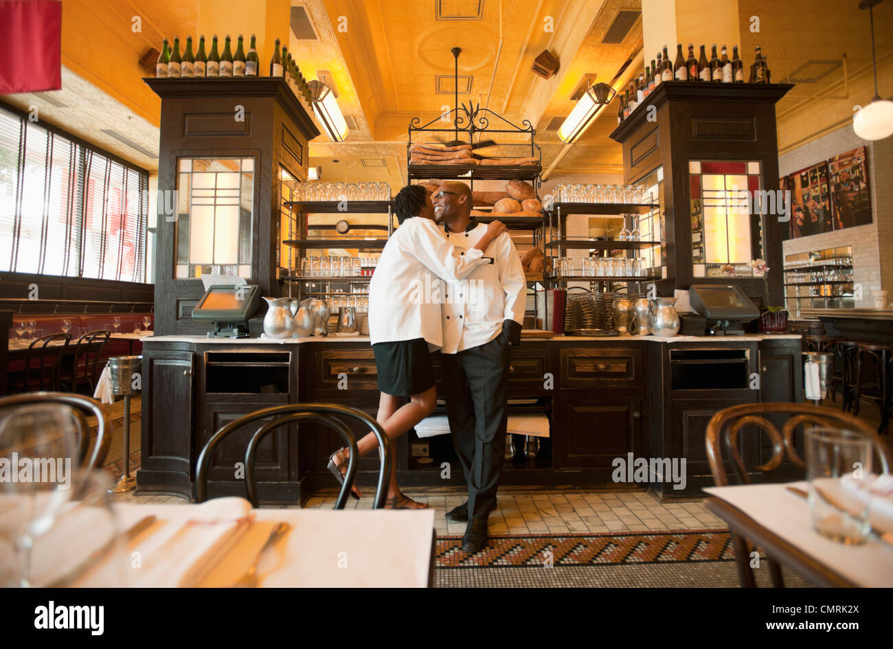 Chef and waitress hugging in restaurant Stock Photo - Alamy