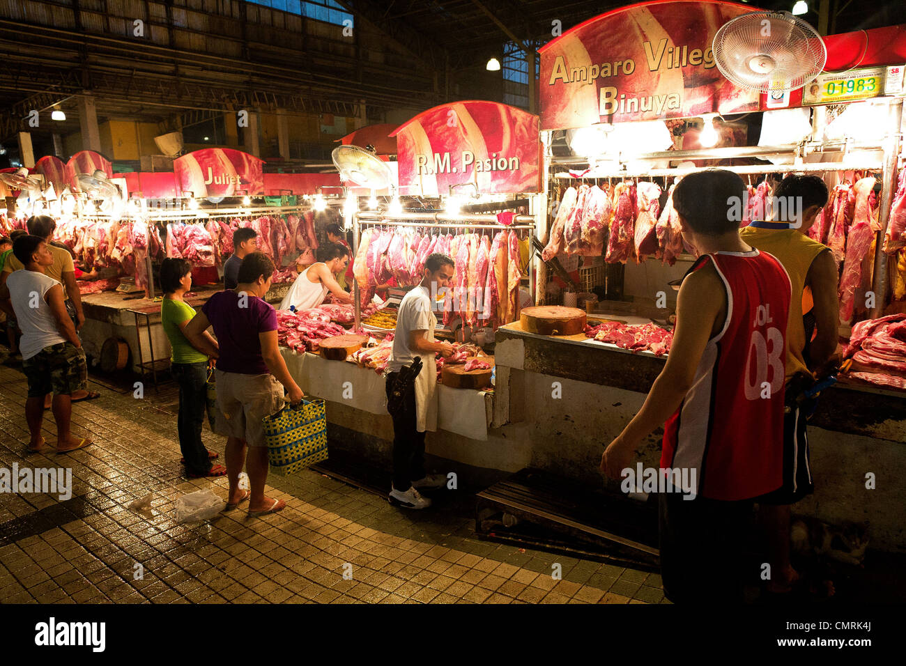 Crowds inspect the cuts of meat on display at the Cubao Farmer's Market ...