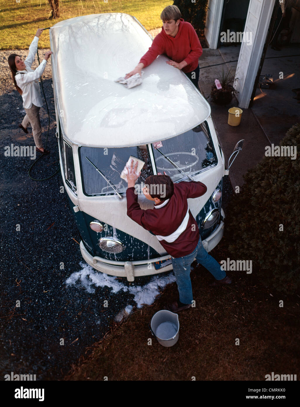 GROUP OF TEENAGE BOYS AND GIRL WASHING A VOLKSWAGEN VAN OUTDOOR Stock ...