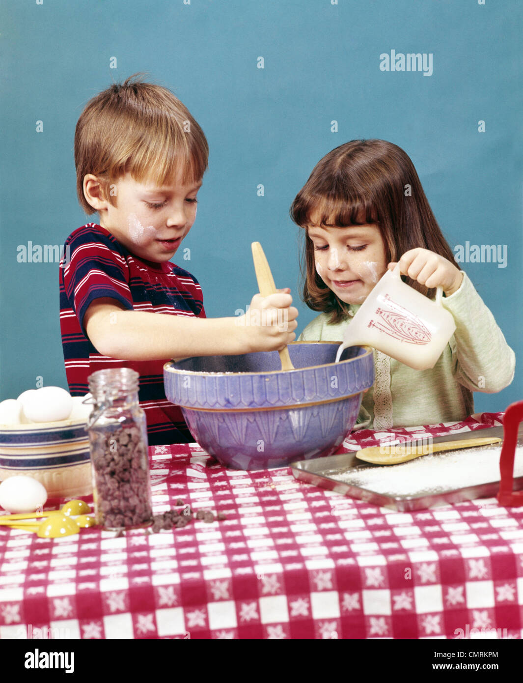 1970 1970s RETRO BOY GIRL BROTHER SISTER MAKING COOKIES STIRRING BATTER ... 1970 1970s RETRO BOY GIRL BROTHER SISTER MAKING COOKIES STIRRING BATTER ...