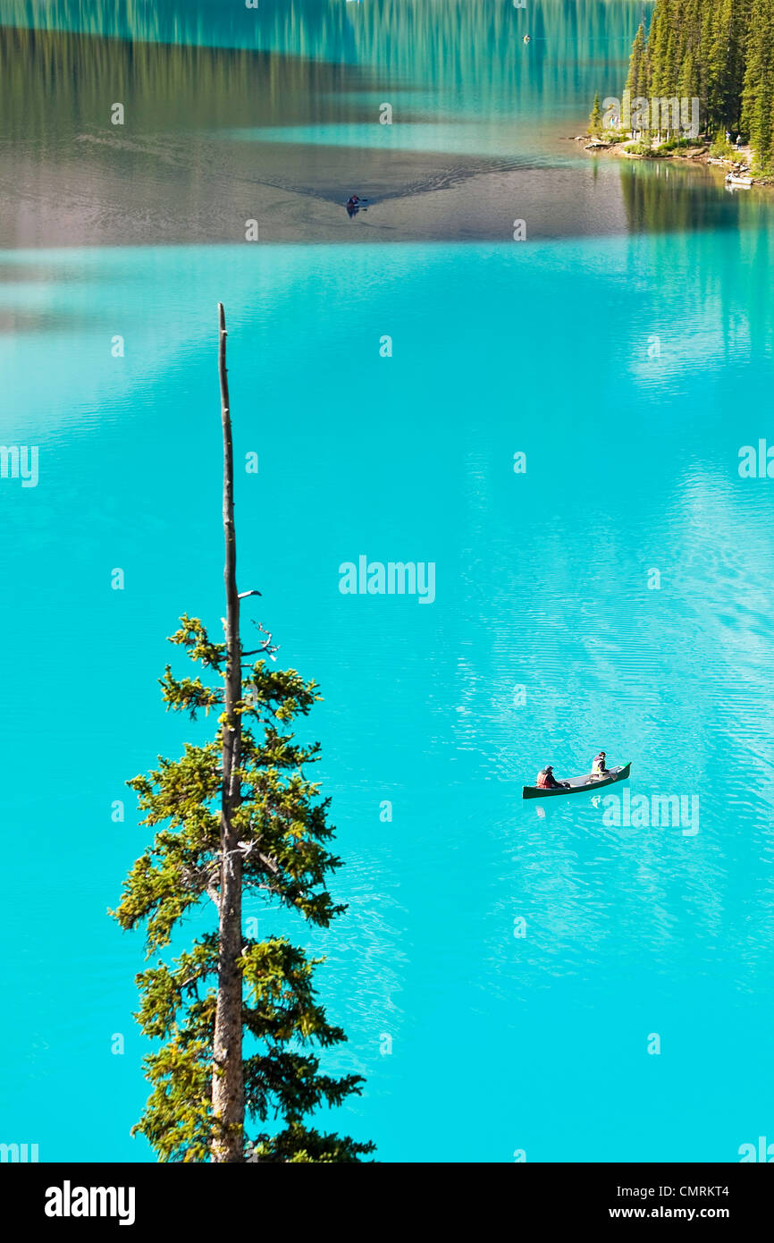 Canoeing on turquoise water of Moraine Lake, Valley of the Ten Peaks ...