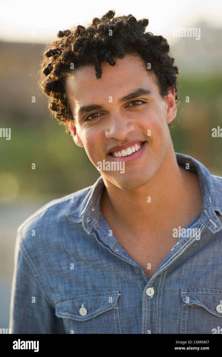 Smiling mixed race man Stock Photo - Alamy