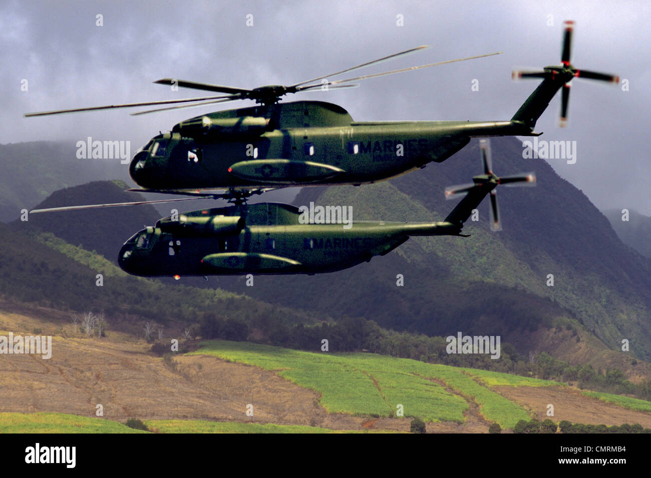 TWO USMC CH-53 SEA STALLION HELICOPTERS FLYING BY MOUNTAINS Stock Photo ...