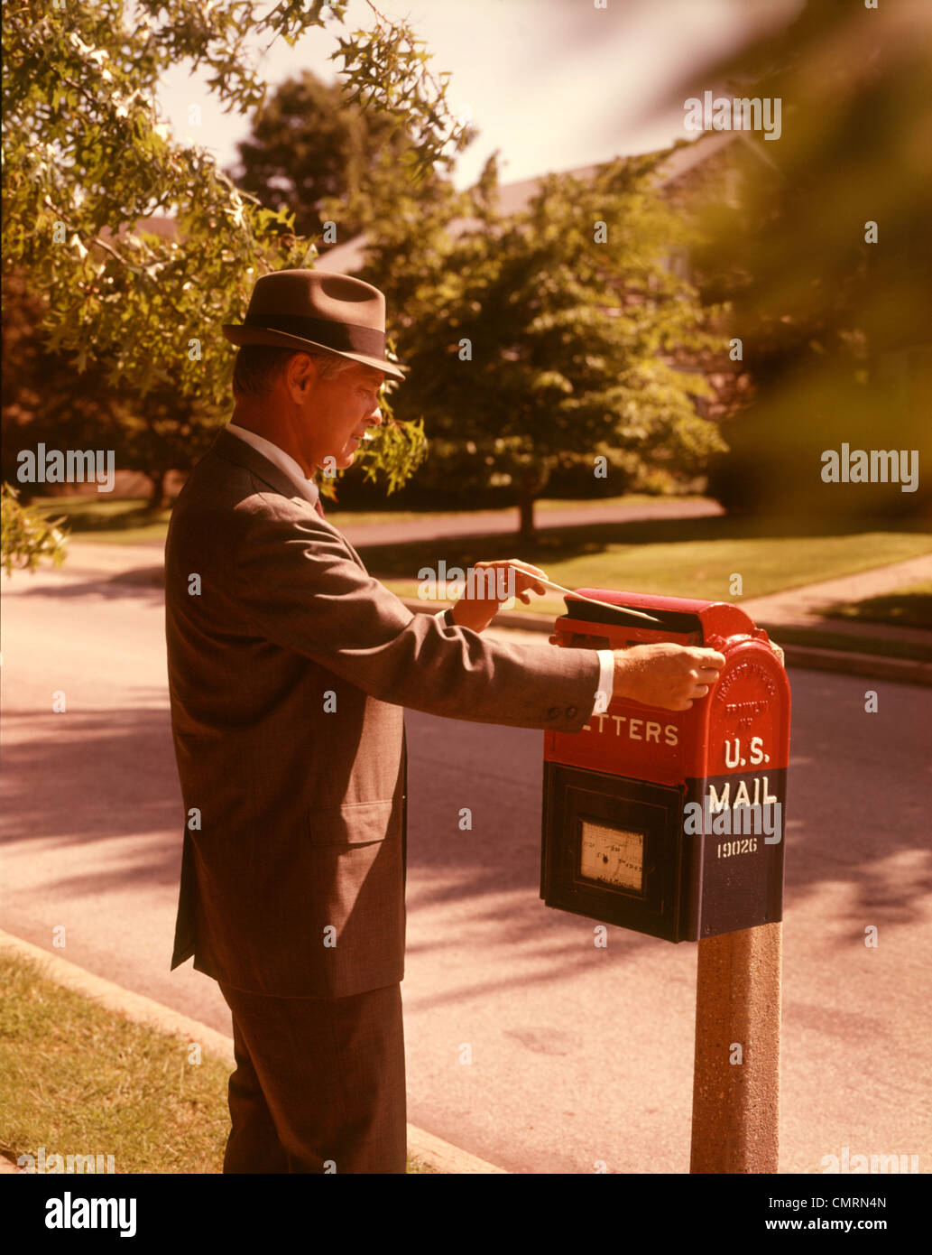 1960 1960s MAN BUSINESS MAN SUIT HAT MAILING LETTER MAILBOX MAIL DROP ...