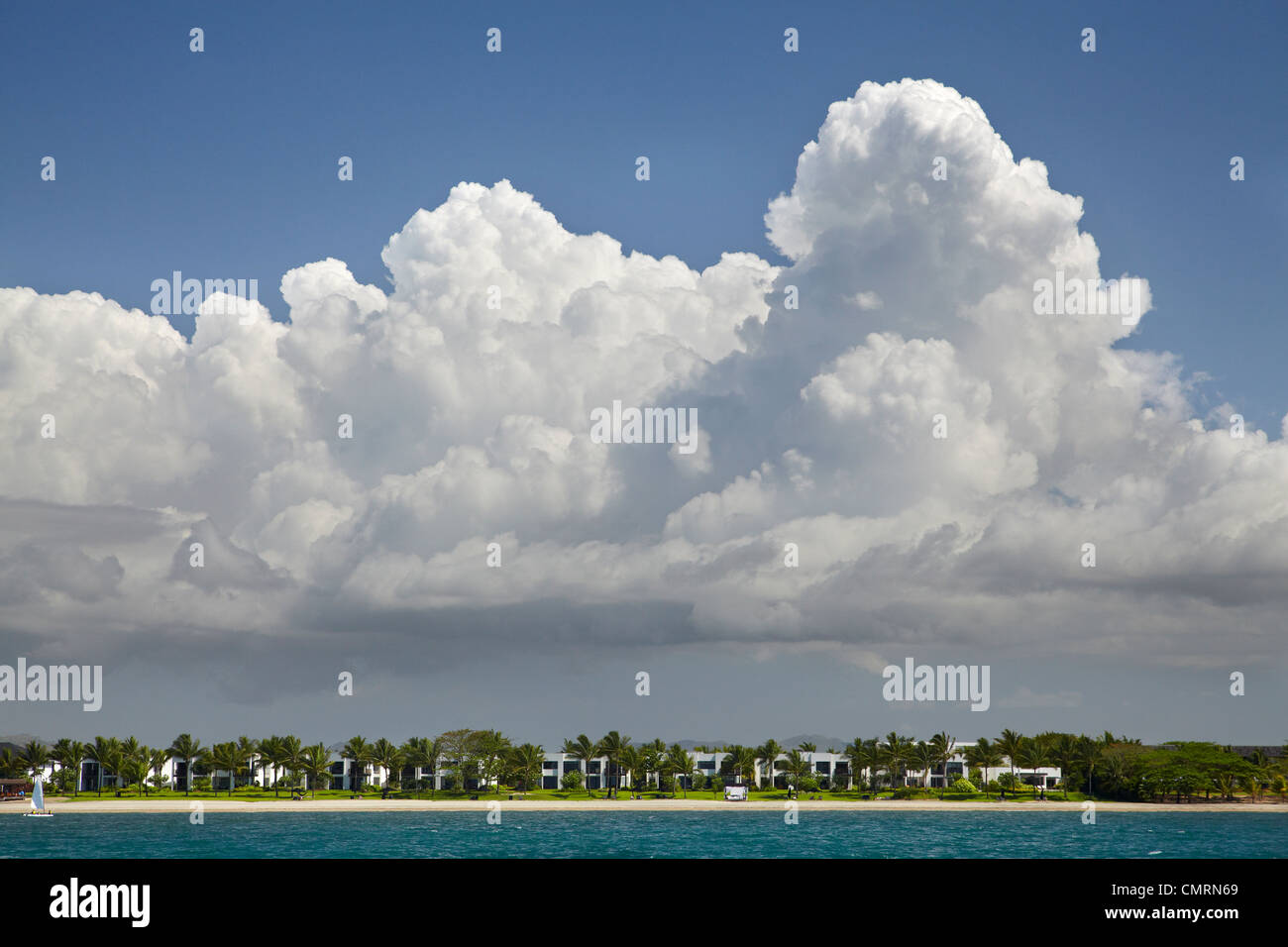 Rain clouds forming over fiji beach resort and spa hi-res stock ...