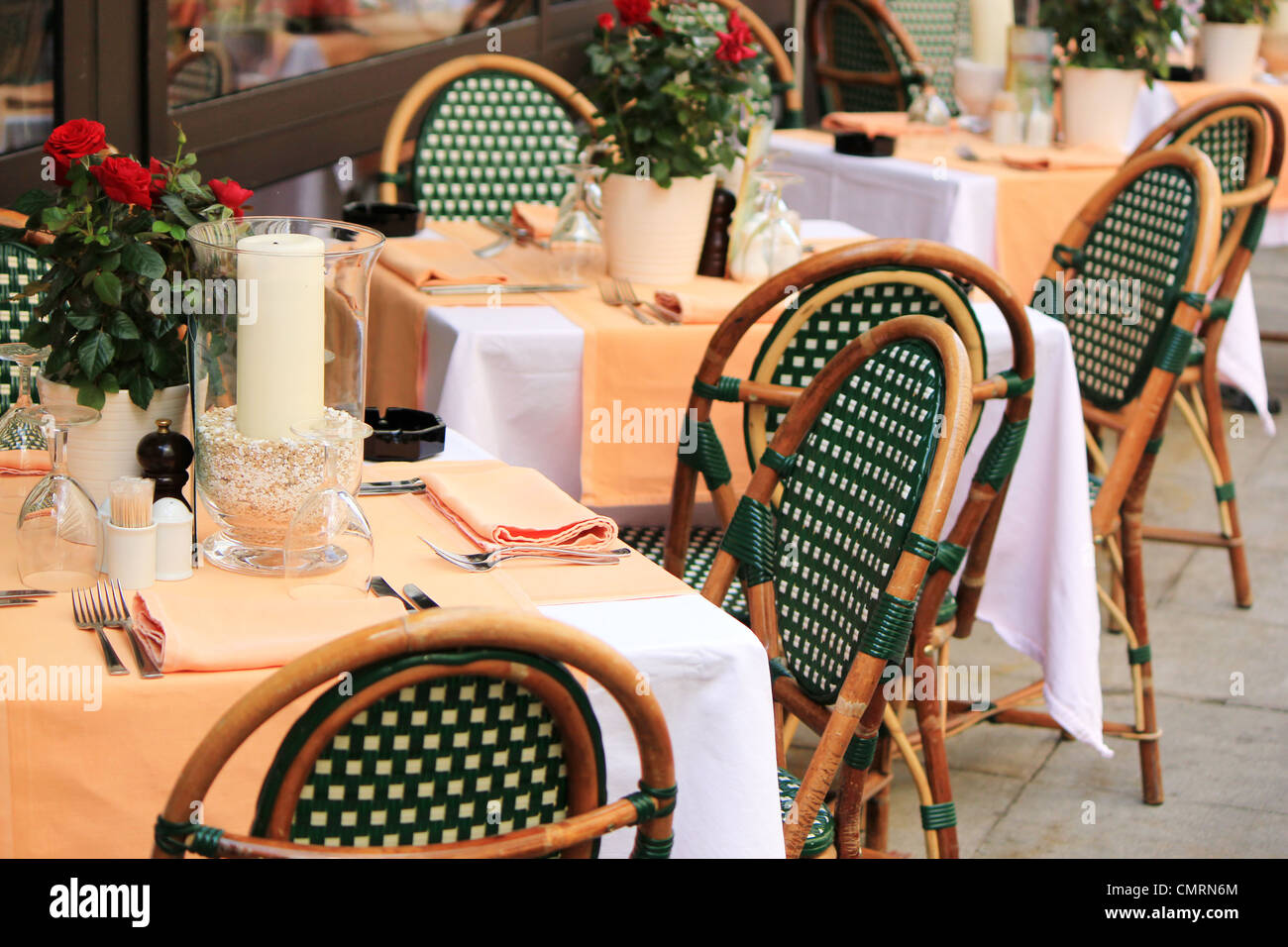 Tables and chairs of restaurant in the street Stock Photo - Alamy