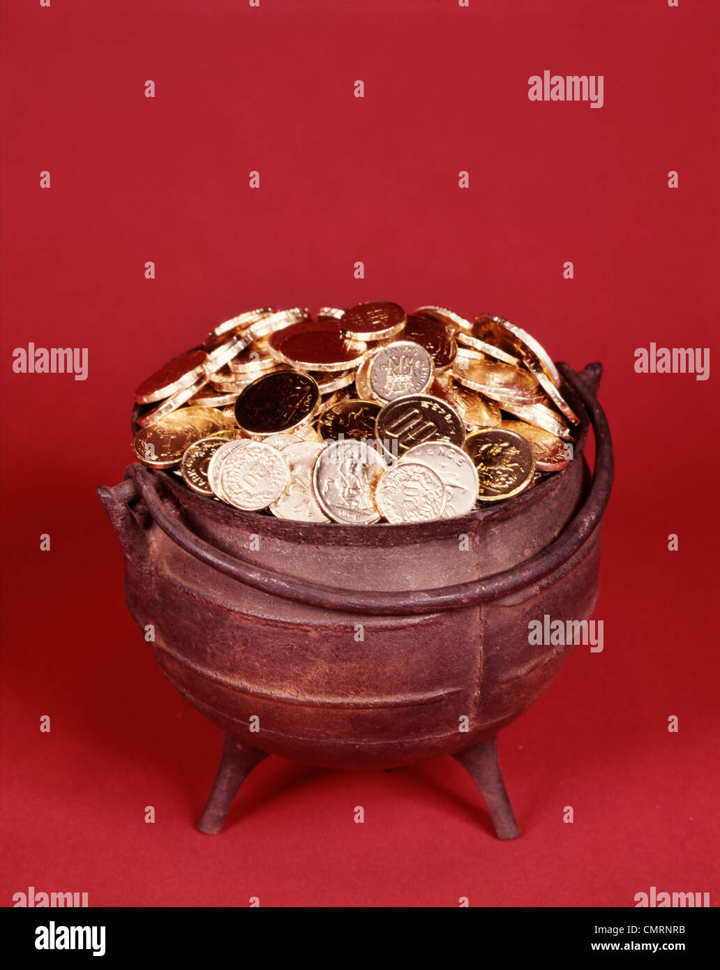 1970 1970s BUCKET GOLD COINS MONEY WEALTH POT OF GOLD Stock Photo - Alamy