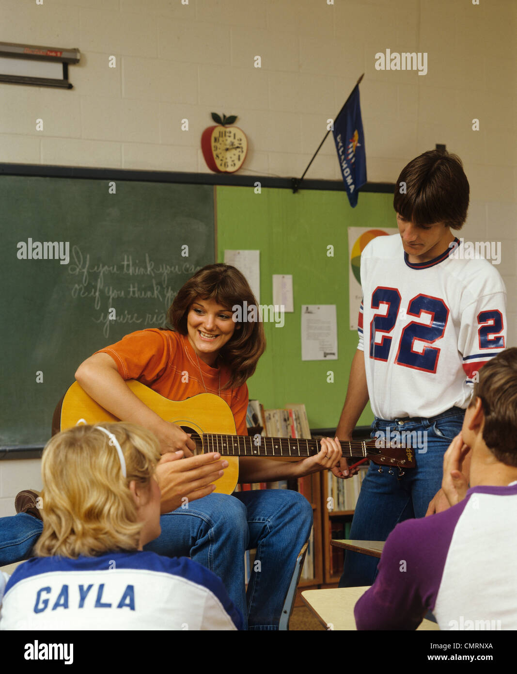 1980s COLLEGE STUDENTS IN CLASSROOM PLAYING GUITAR Stock Photo - Alamy