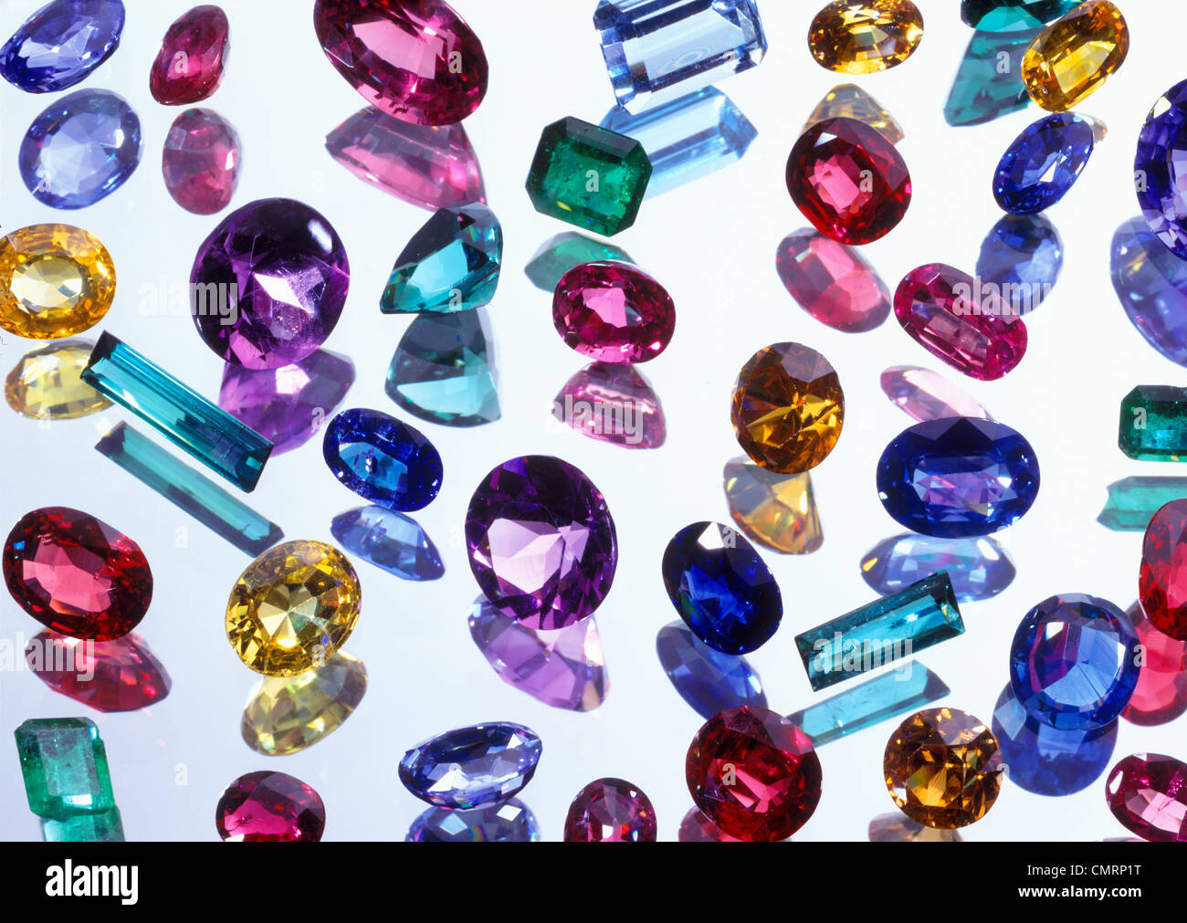ASSORTED GEMSTONES ON REFLECTIVE SURFACE Stock Photo - Alamy