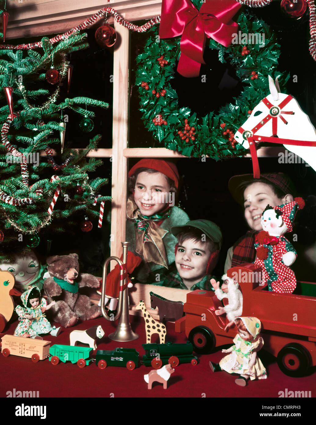 1950s THREE CHILDREN LOOKING IN TOY STORE WINDOW BOYS GIRL WISHING ...