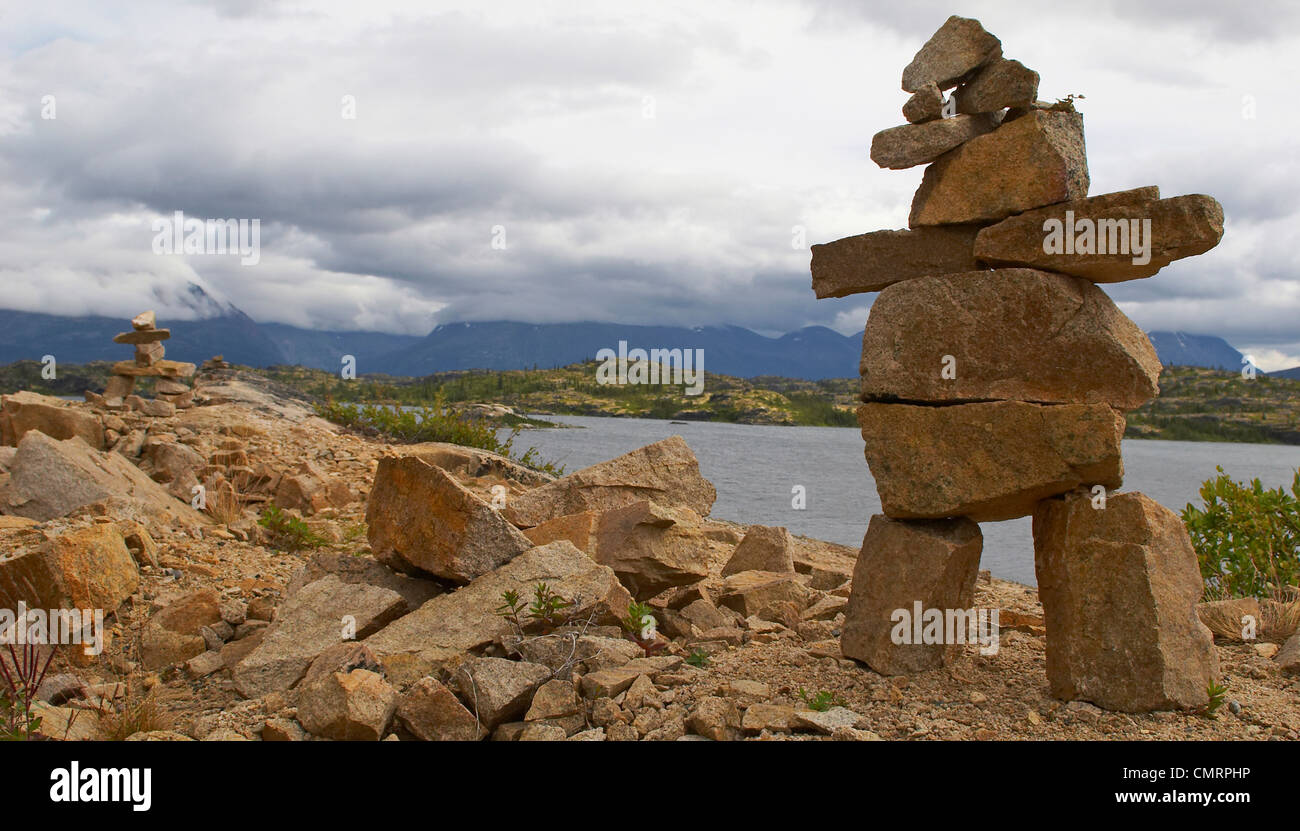 Two inukshuks on the Canadian side of the Canadian-American border ...