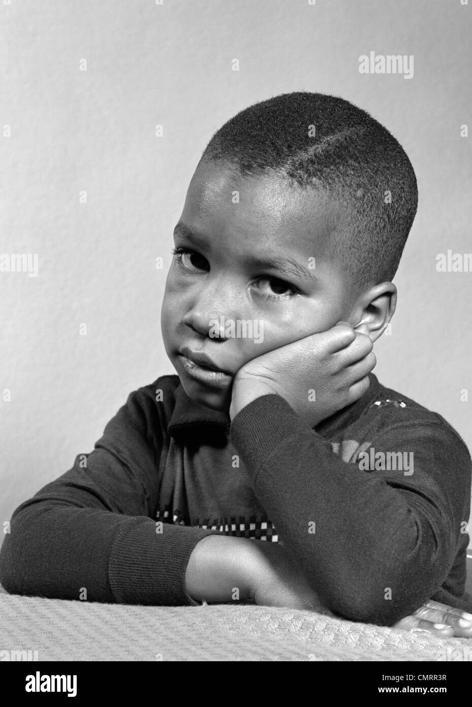 1940s 1950s PORTRAIT OF SAD UNHAPPY AFRICAN-AMERICAN BOY HEAD RESTING ...