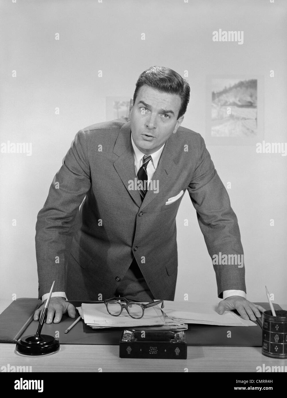 Serious businessman office desk looking Black and White Stock Photos ...