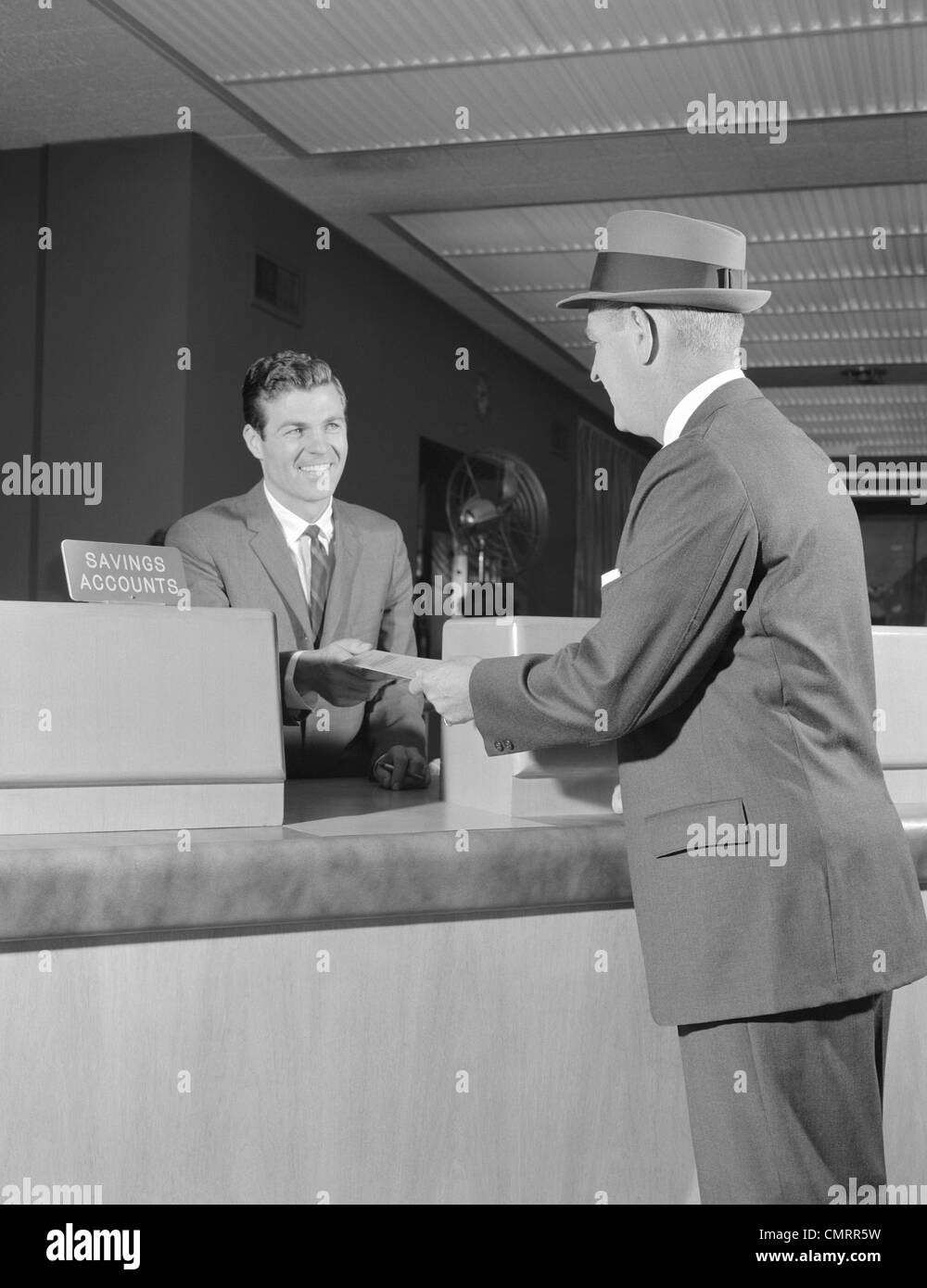 Bank teller Black and White Stock Photos & Images - Alamy