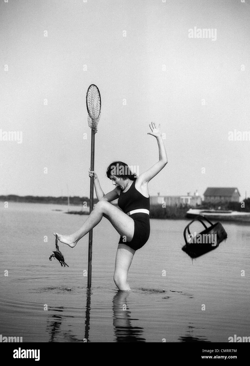 1920s WOMAN CRABBING SURPRISED BY CRAB BITING HER TOE Stock Photo - Alamy
