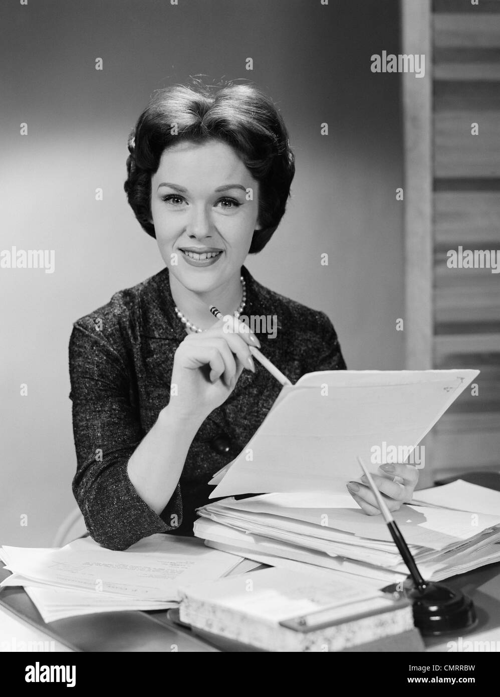 1950s 1960s PORTRAIT SMILING EXECUTIVE WOMAN HOLDING FILES PAPERS ...