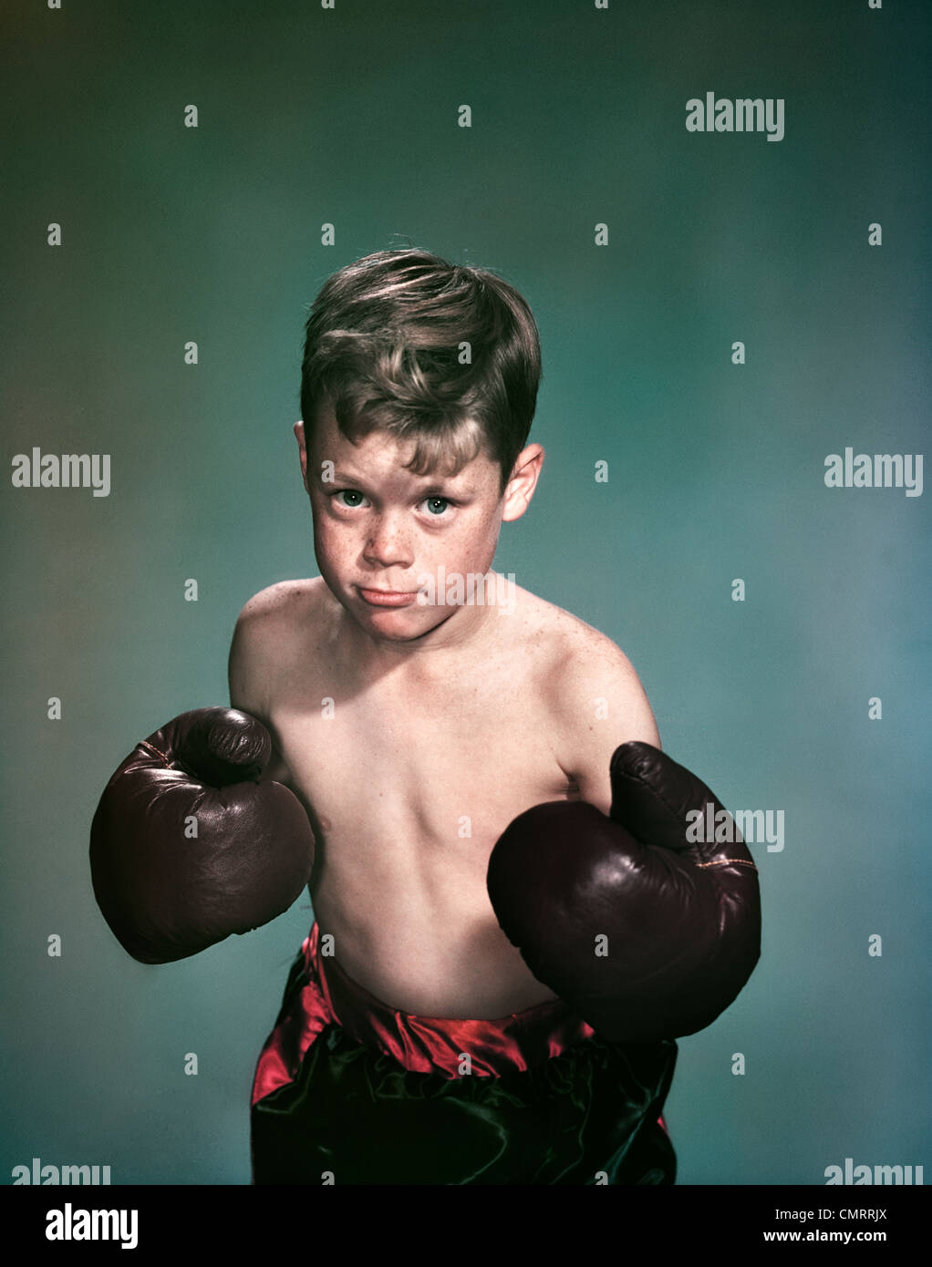 1940s 1950s PORTRAIT BOY WEARING BOXING GLOVES AND TRUNKS Stock Photo ...