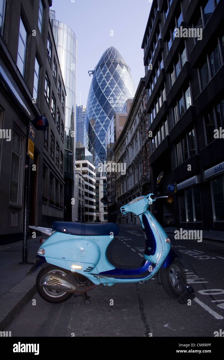A moped parked in a back street by the Swis Re Building in London's ...